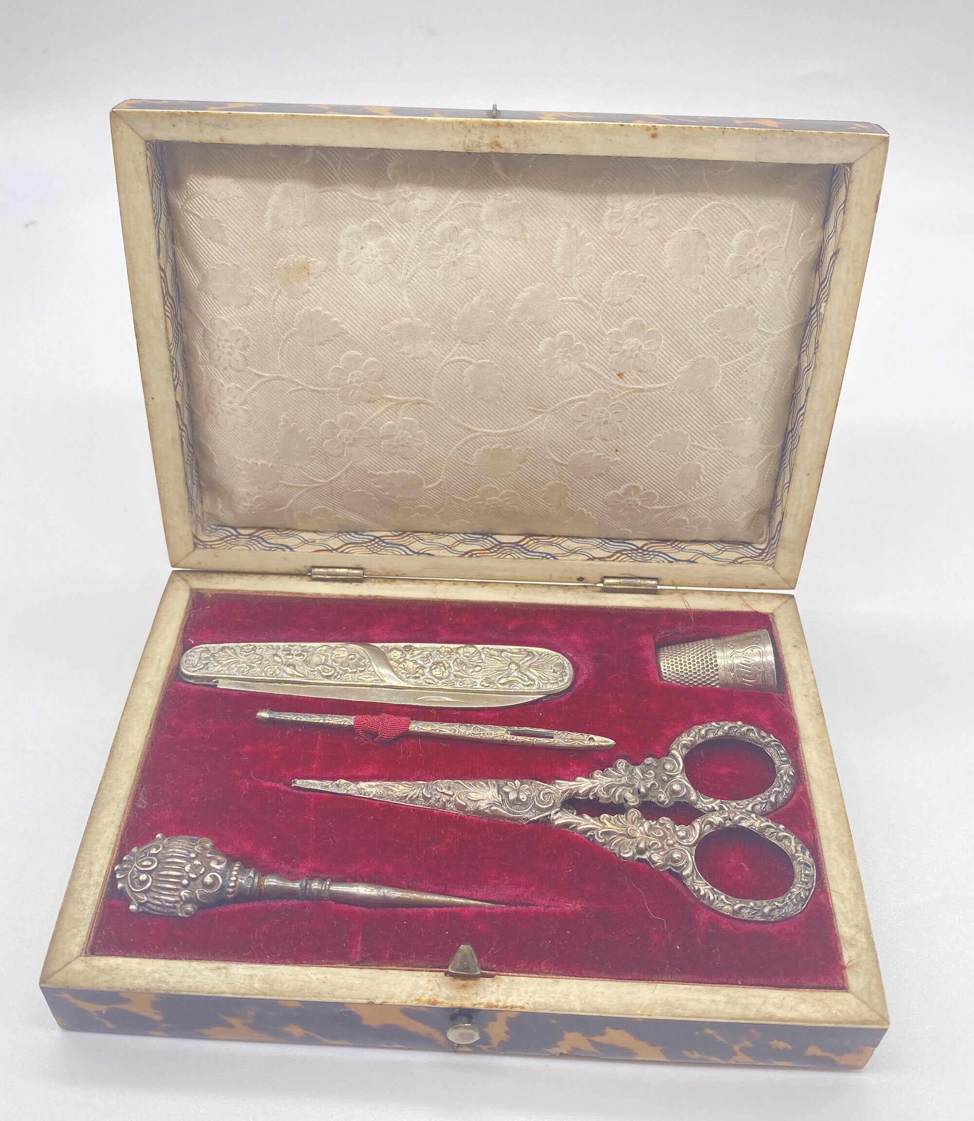 Victorian silver matching decorative repousse sewing set set in a ...